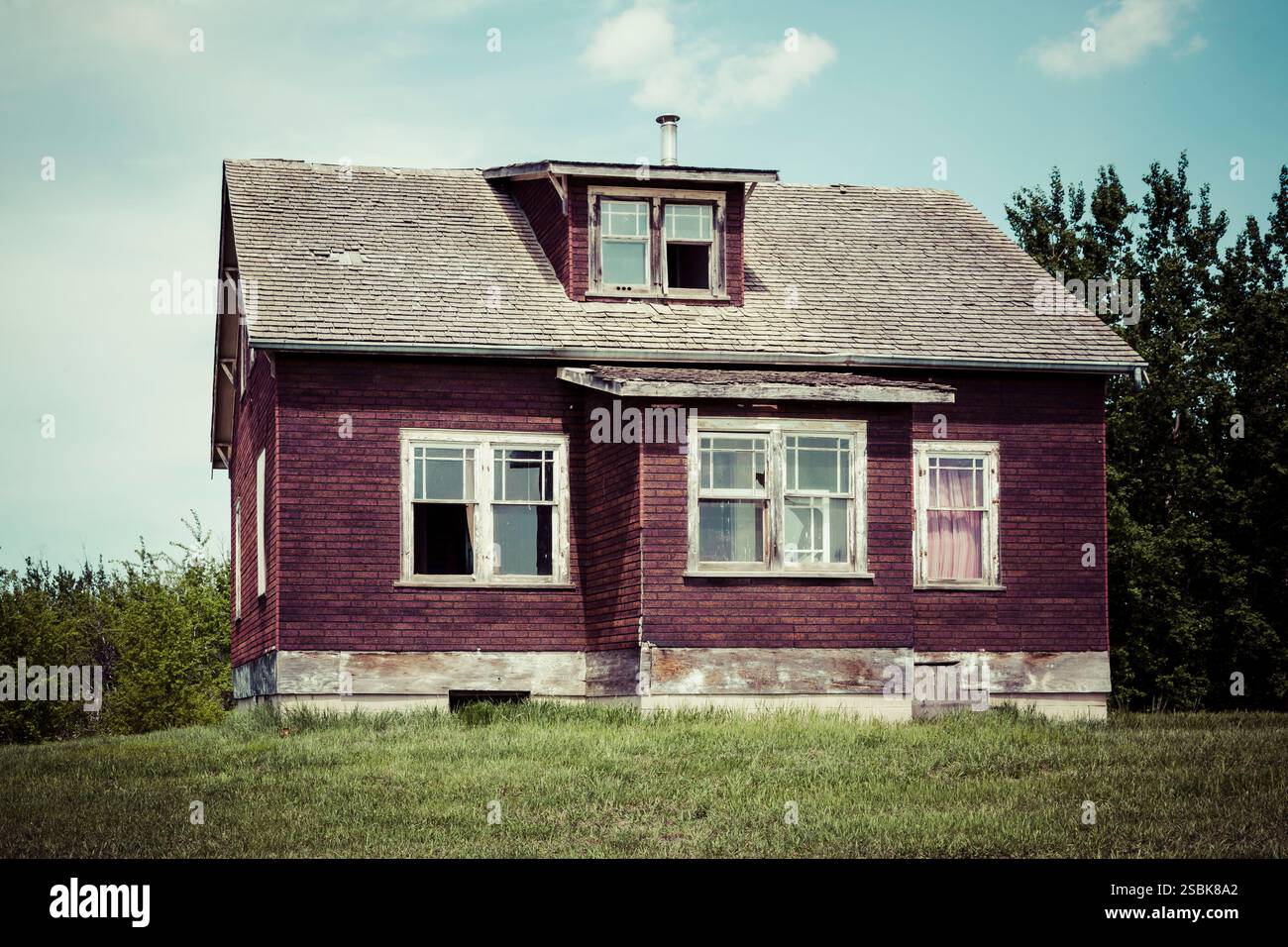 Small red house with a chimney. The house is old and has a lot of ...