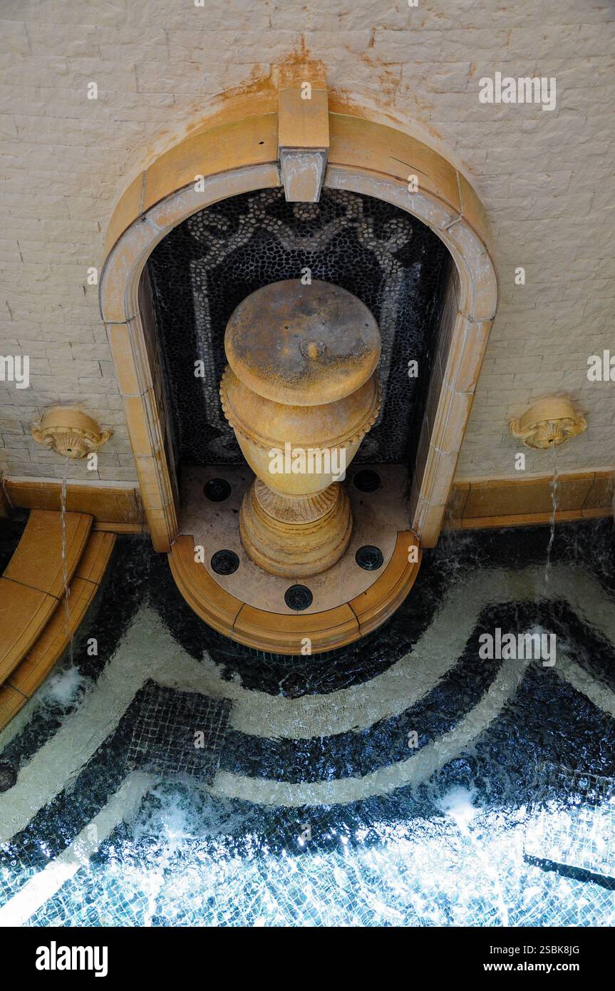 Elegant classical stone fountain with gentle water flow in a serene ...