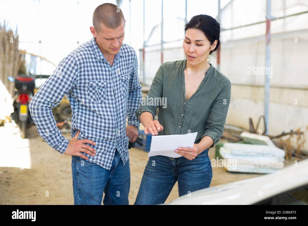 Farmer signing contract with representative of transport company Stock ...