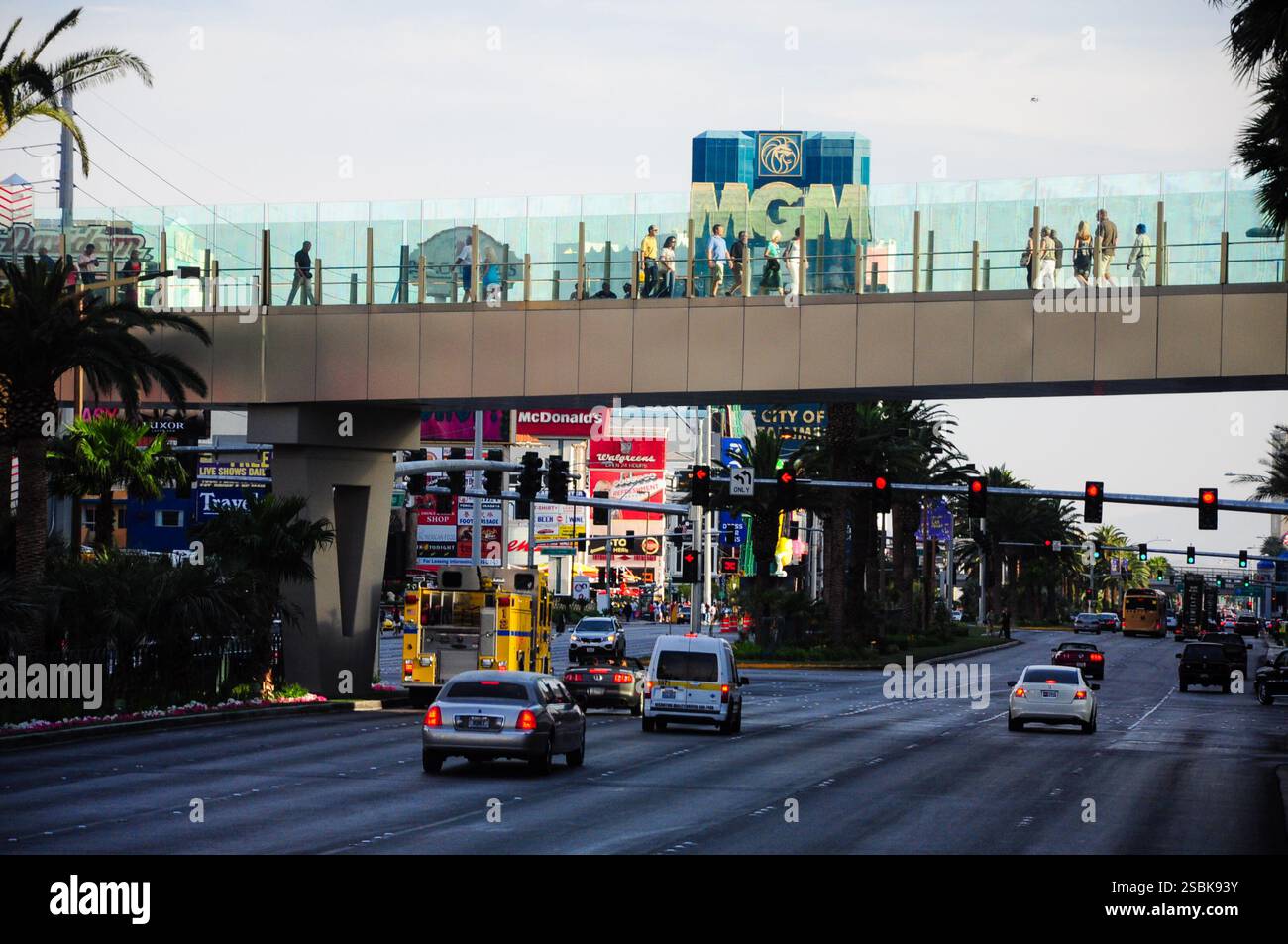 Urban street under pedestrian bridge linking city attractions Stock ...