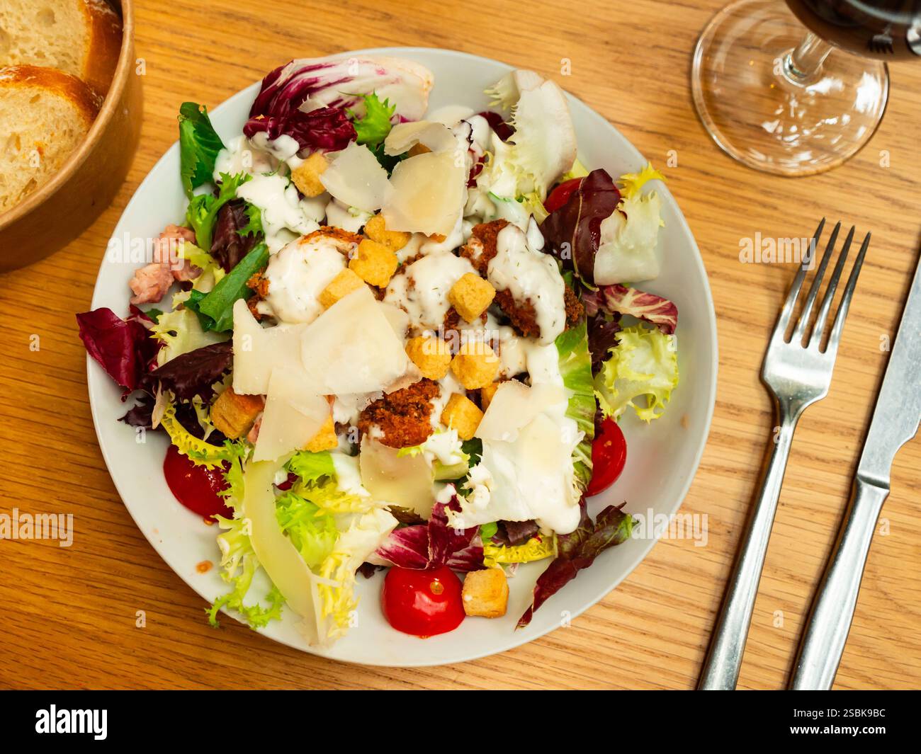 Caesar salad with chicken and parmesan cheese Stock Photo - Alamy