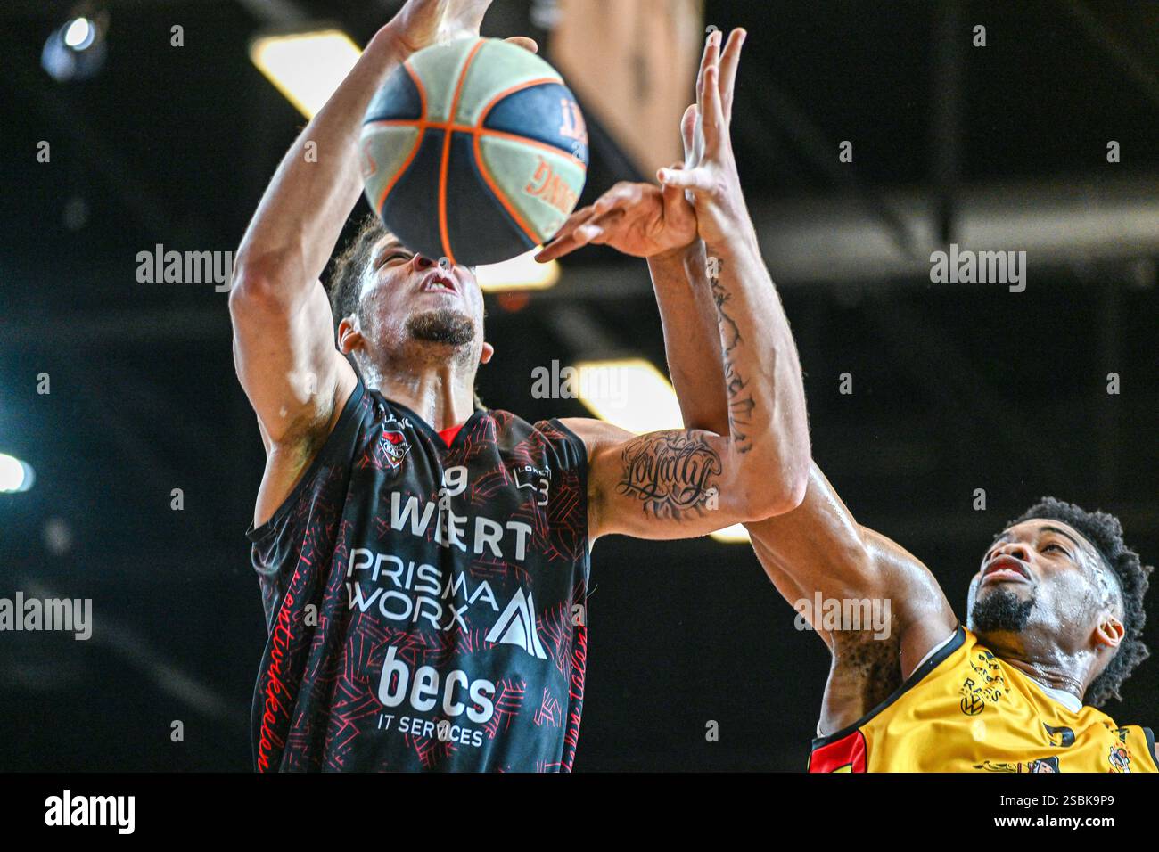 Lionel Colson (19) of Basket Academie Limburg and EJ Anosike (3) of ...