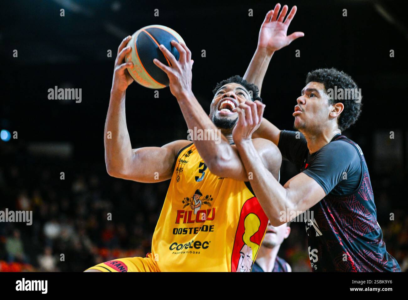 EJ Anosike (3) of Filou Oostende and Rene-Charles Louis-Therese (21) of ...