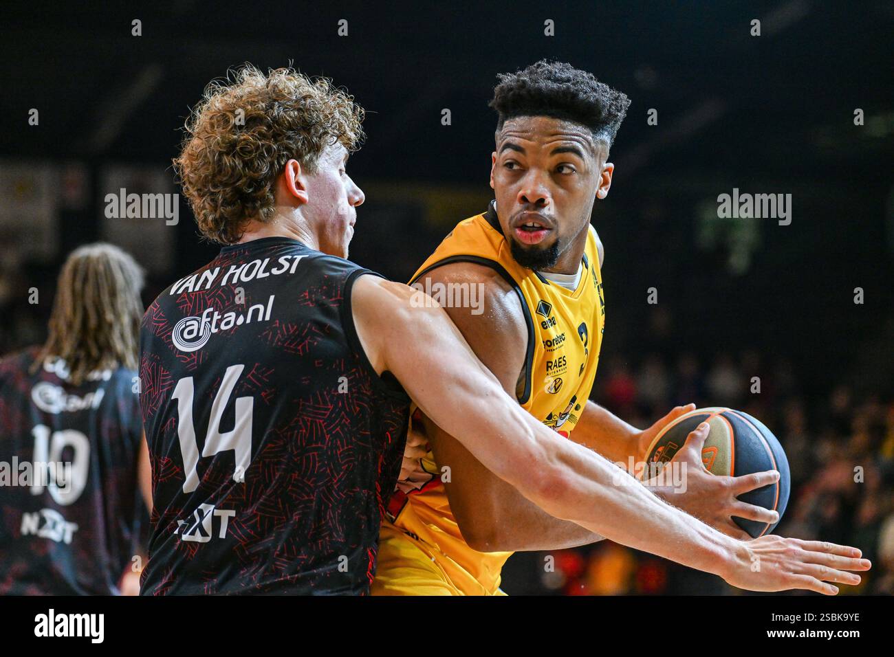 EJ Anosike (3) of Filou Oostende and Niels van Holst (14) of Basket ...