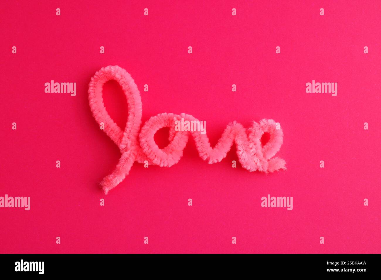 Pink word love with a plush texture Stock Photo - Alamy