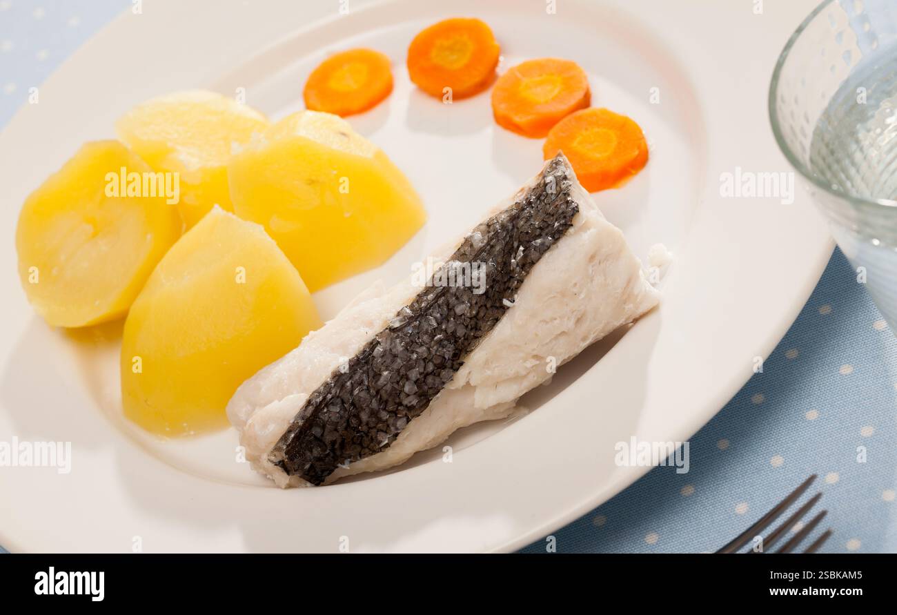 Steamed hake with potatoes and carrot Stock Photo - Alamy