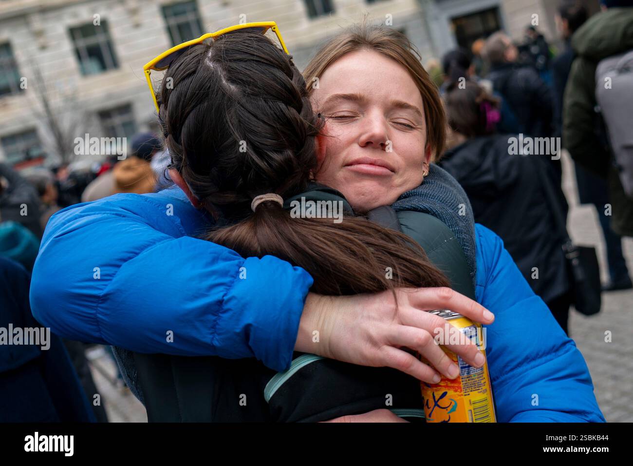 Washington, United States. 03rd Feb, 2025. People embrace outside the U ...