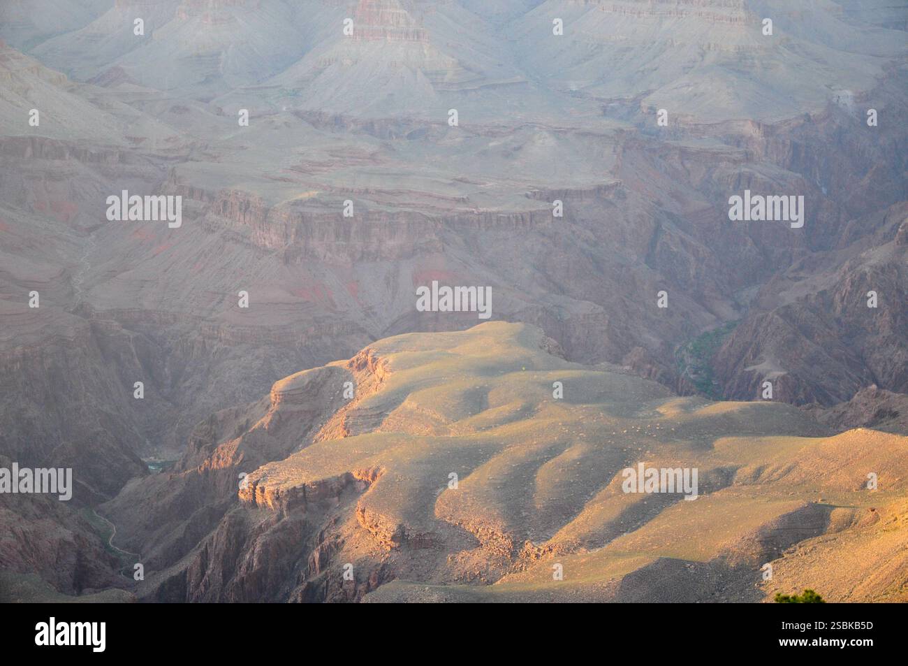 Grand Canyon's sunlit landscape with iconic layered formations and ...