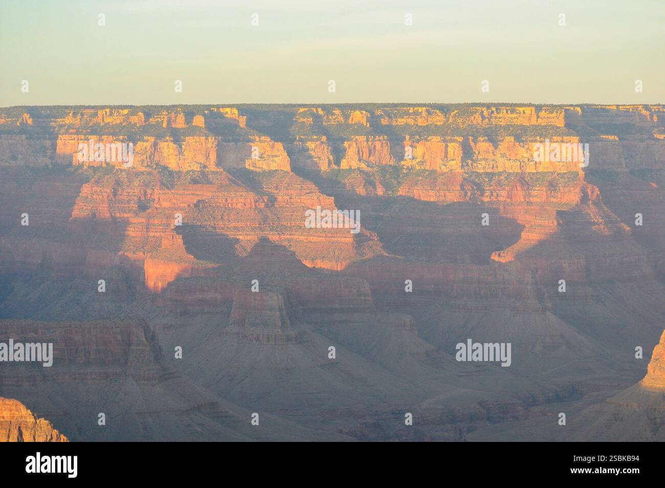 Grand Canyon cliffs at sunrise with vibrant ancient rock layers Stock ...