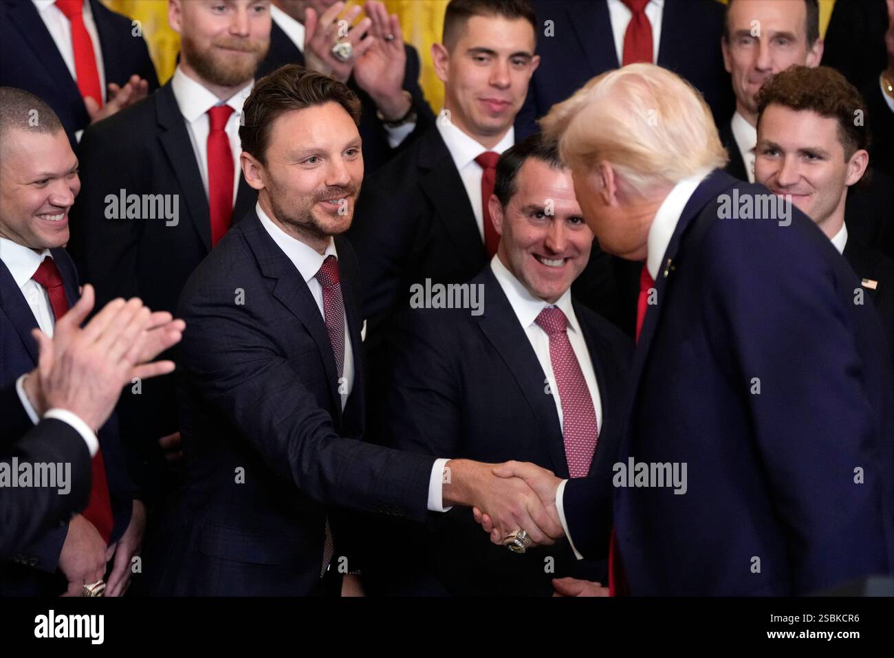 President Donald Trump shakes hands with Sam Reinhart during a ceremony ...