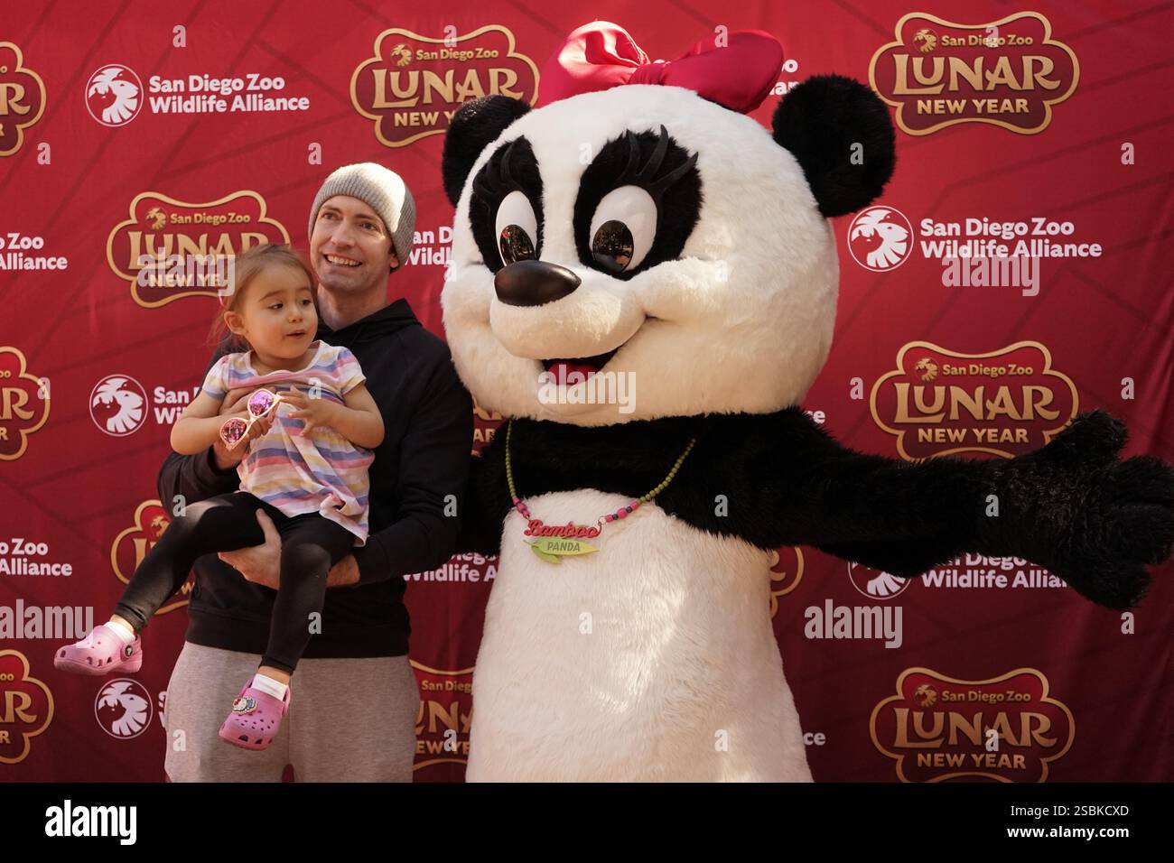 San Diego, USA. 2nd Feb, 2025. People pose for photos with a giant ...