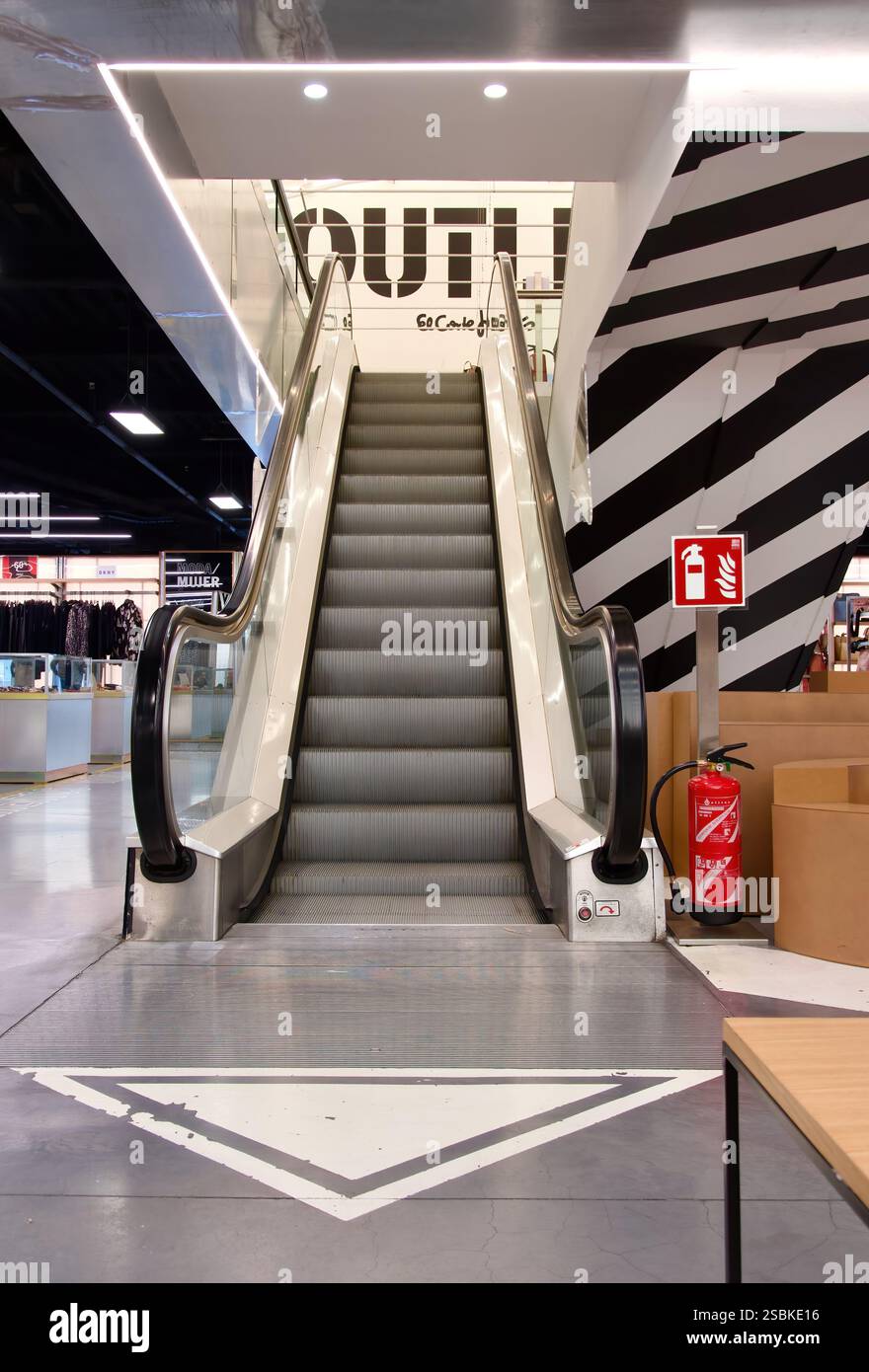 Escalator inside the El Corte Ingles outlet department store in the ...