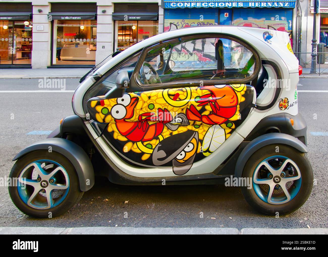 Cartoon style doors with paella on a restaurant delivery Renault Twizy ...