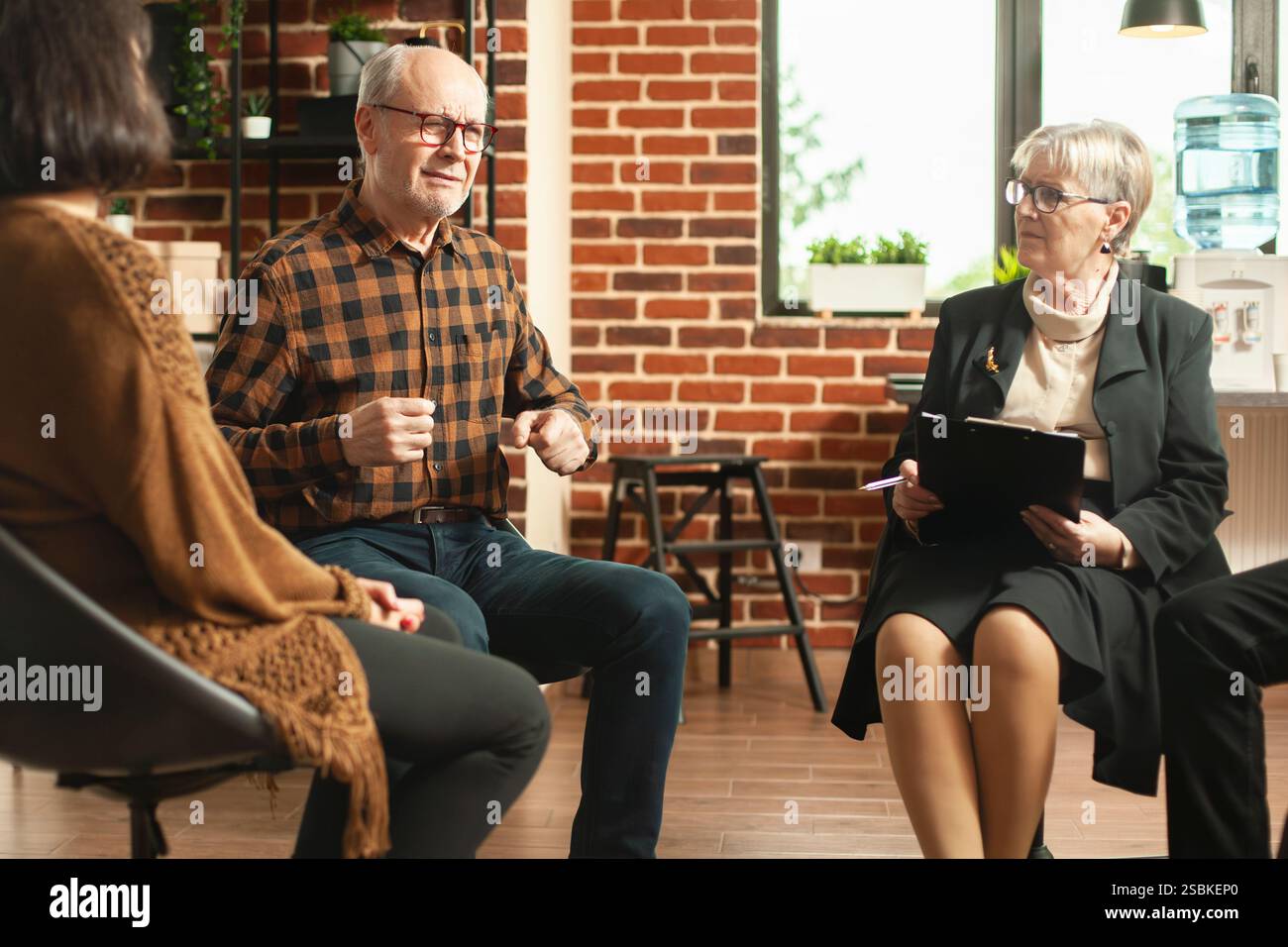 Caucasian old man shares his struggles as senior female psychologist ...