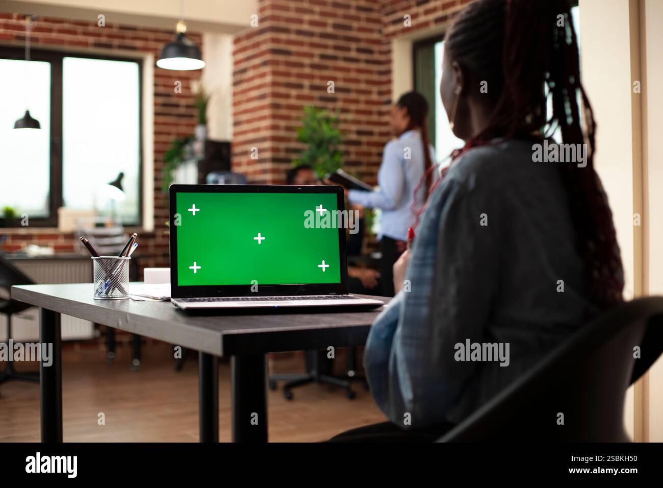Office employee looks greenscreen sitting hi-res stock photography and ...