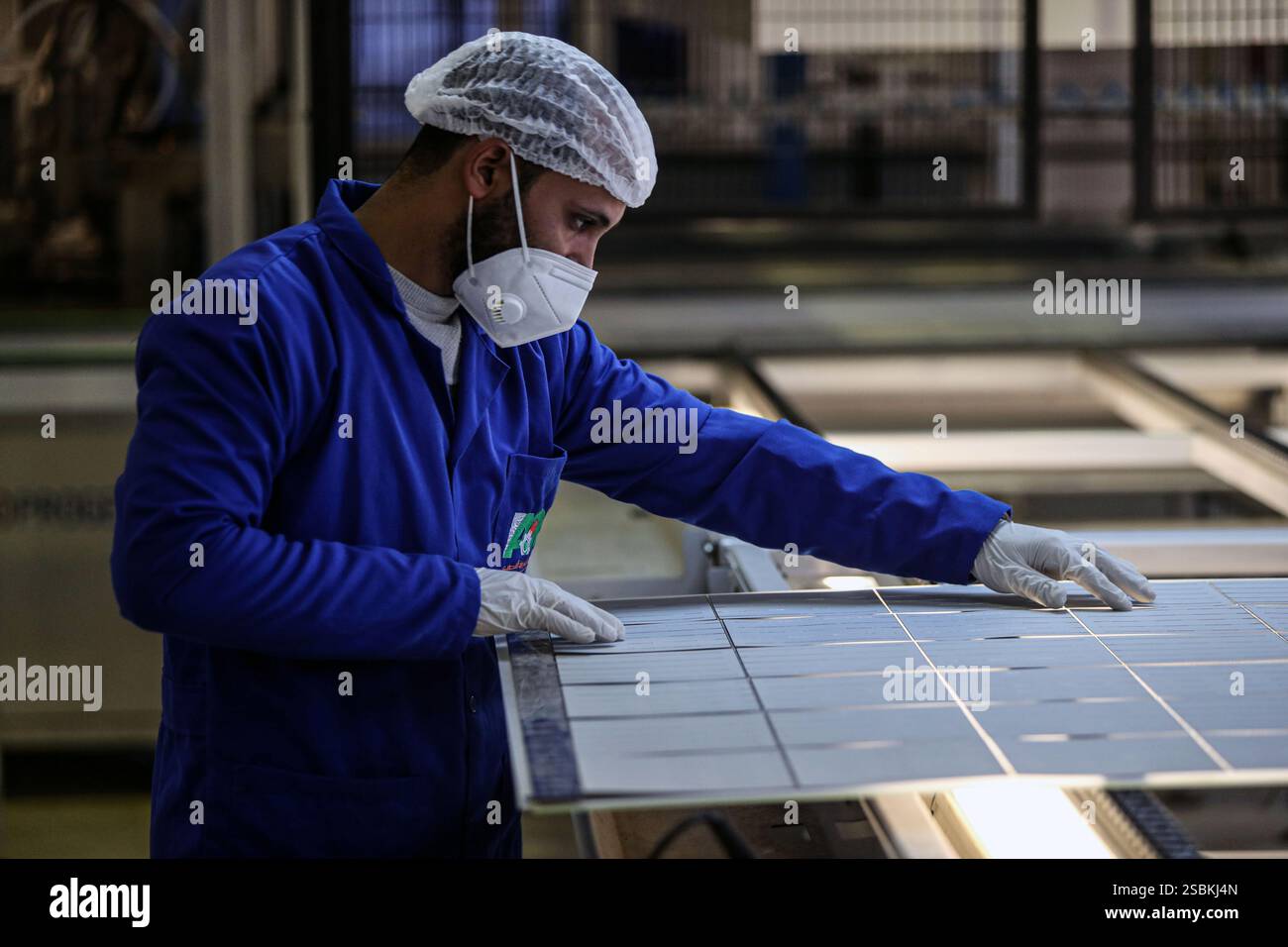 Cairo, Egypt. 1st Feb, 2025. A man works at a solar panel factory in ...
