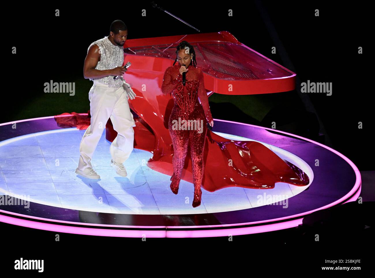 February 11, 2024, California, USA: Usher and Alicia Keyes sing a duet ...