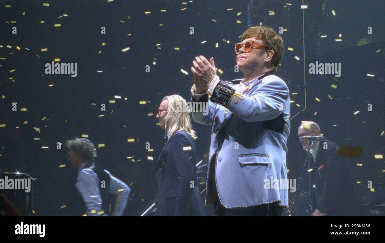 ELTON JOHN: NEVER TOO LATE, Elton John, and his band receive a standing ...