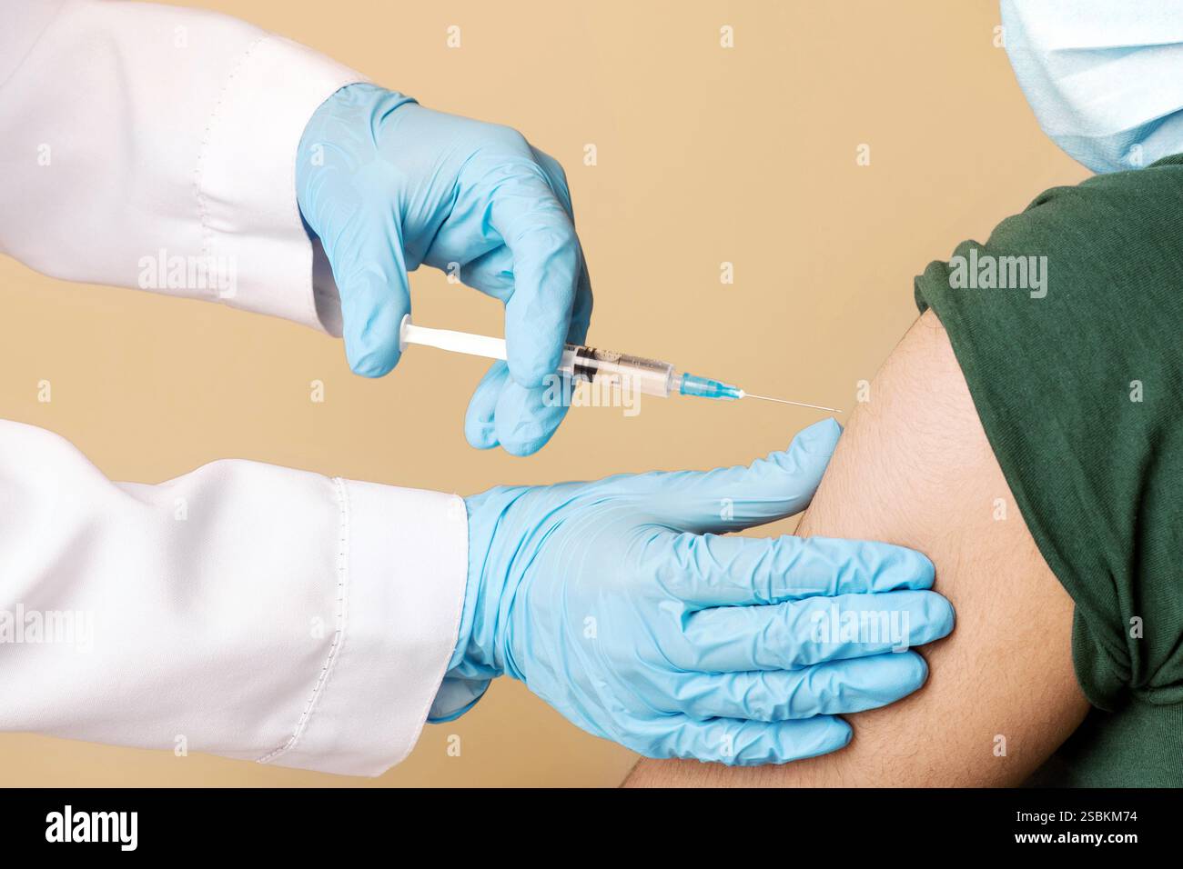 Nurse making intramuscualr injection for arab man at clinic, closeup ...