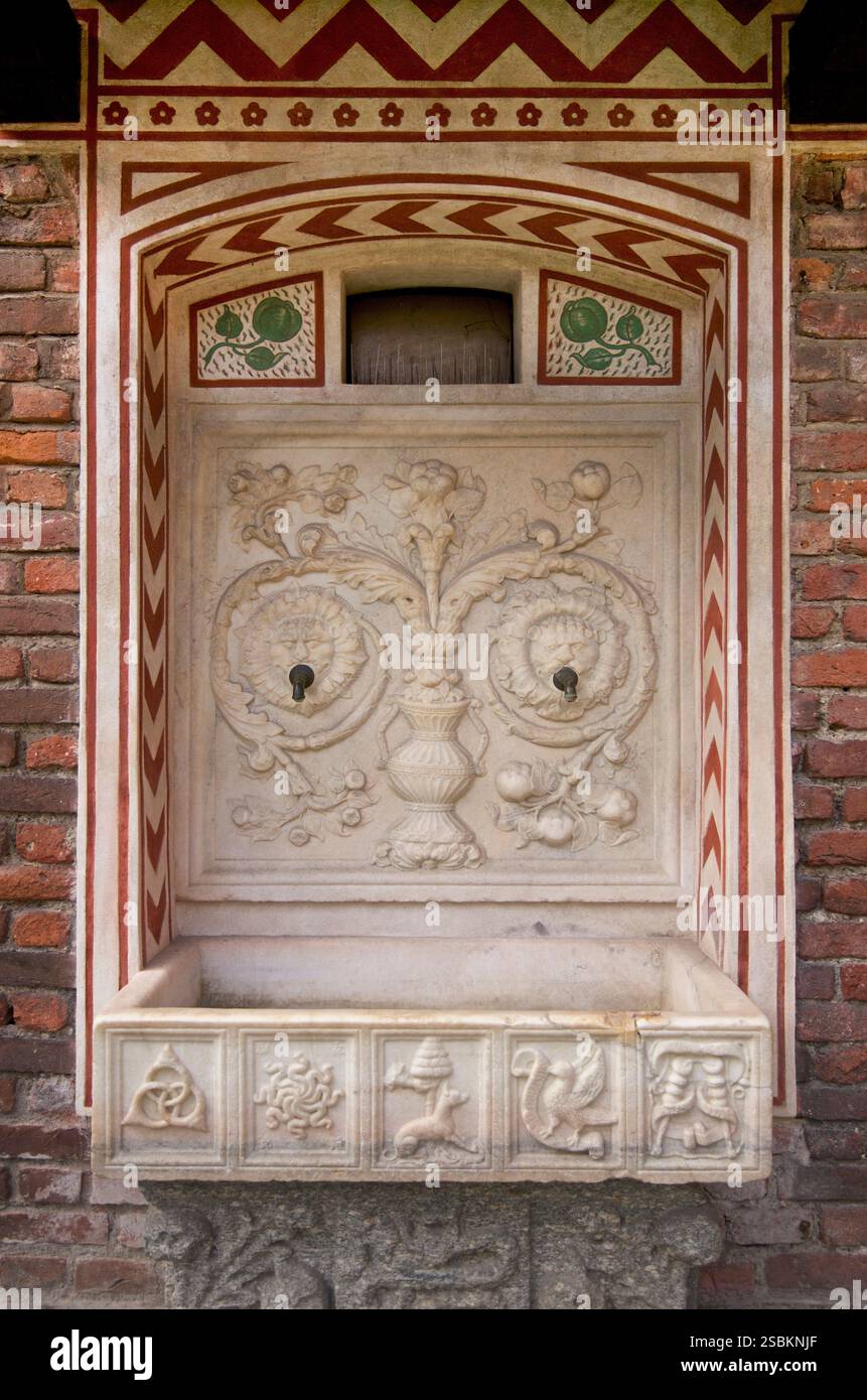 Water fountain a wall at the Castello Sforzesco complex. Sforza Castle ...