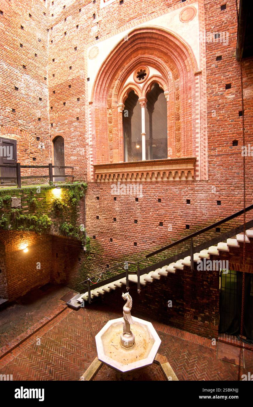 Brickwork courtyard with fountain inside Castello Sforzesco. Sforza ...