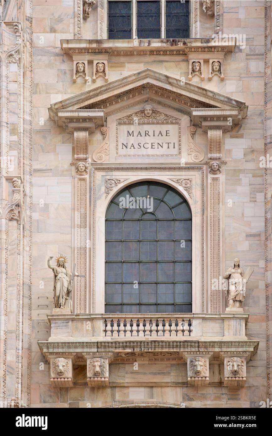 Detail of ornate window and surrounding carved stone masonry of Milan ...