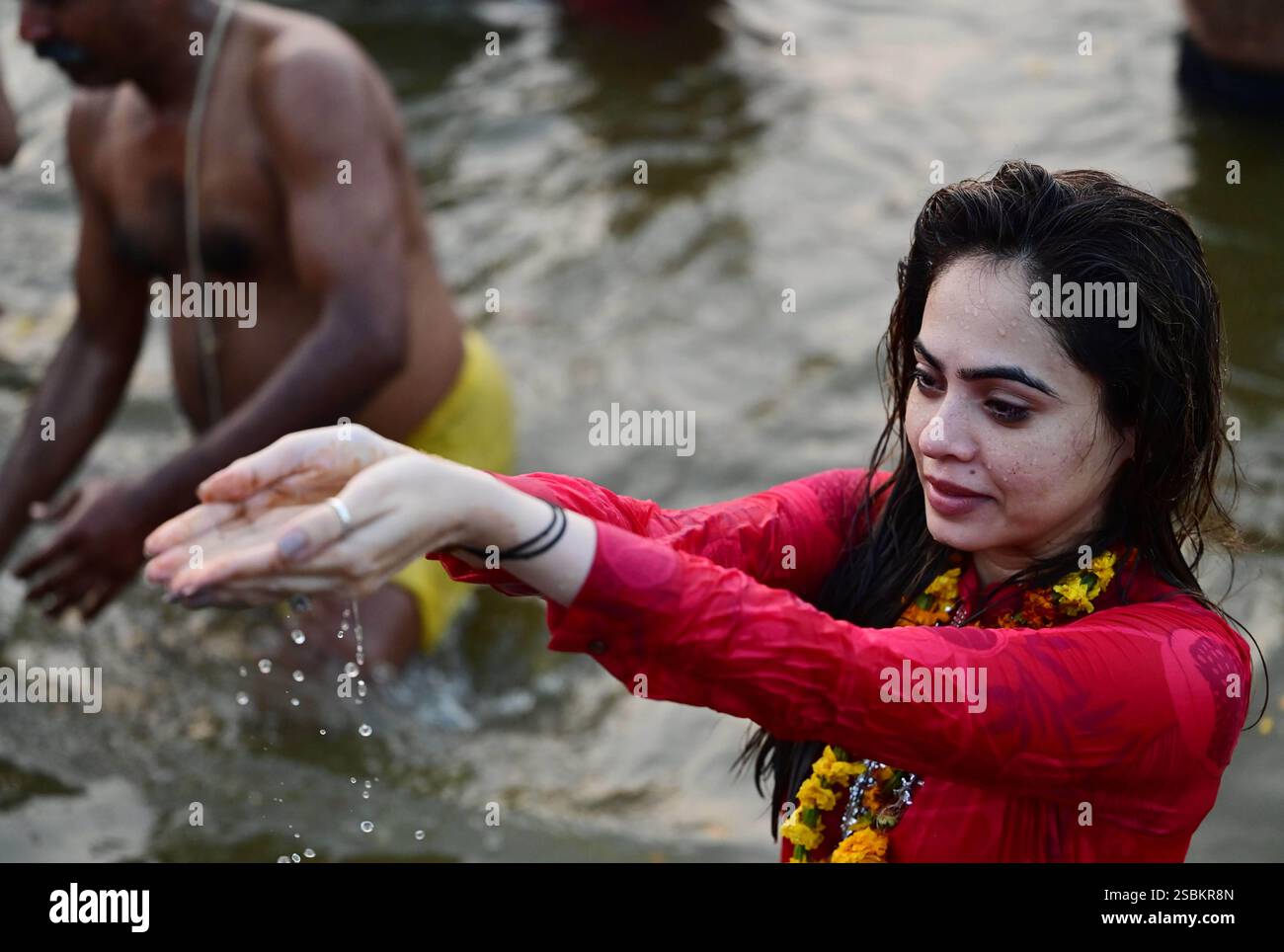 PRAYAGRAJ, INDIA - FEBRUARY 3: Female Sanyasini taking a holy dip ...