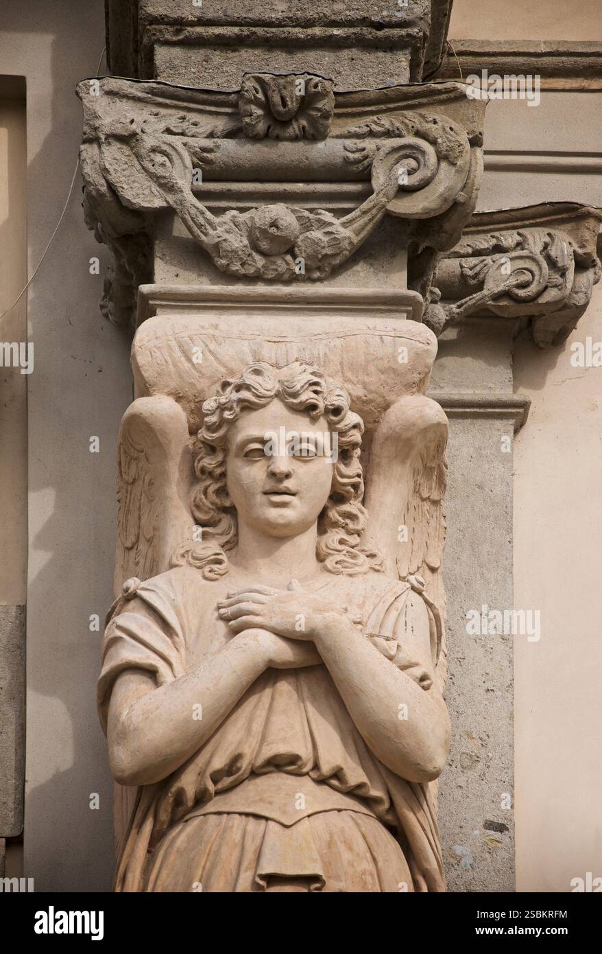 Detail of Archangels carved either side of the door to the Basilica di ...