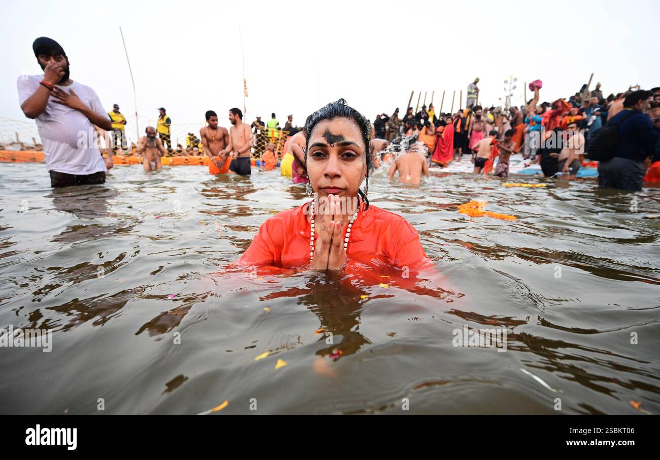 PRAYAGRAJ, INDIA - FEBRUARY 3: Female Sanyasini taking a holy dip ...