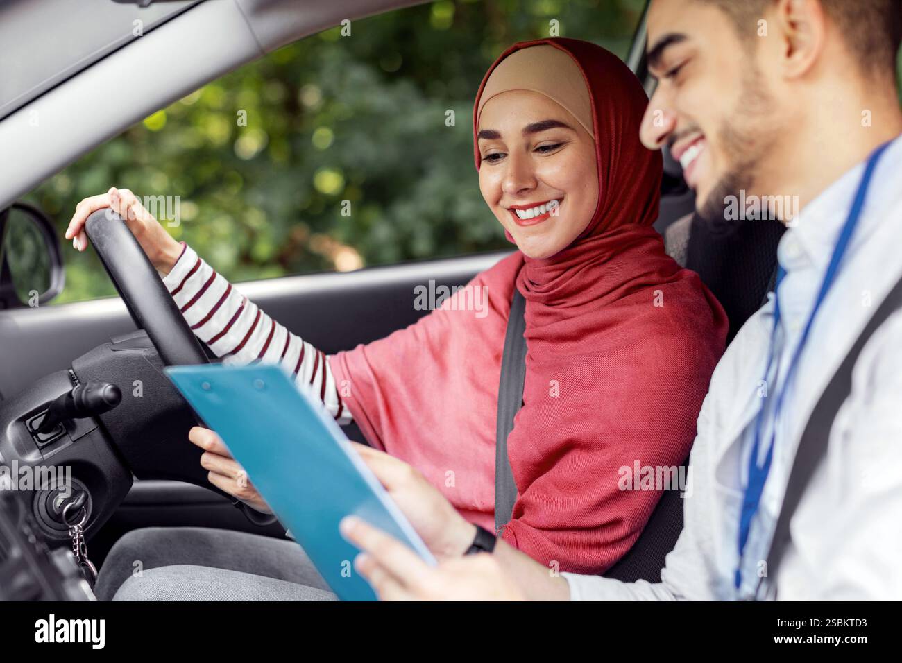 Smiling millennial middle eastern man, explain rules, put mark for ...
