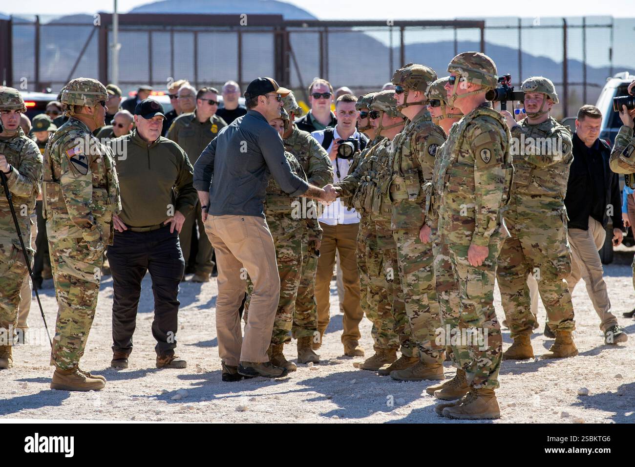Defense Secretary Pete Hegseth, center left, greets Army soldiers while ...