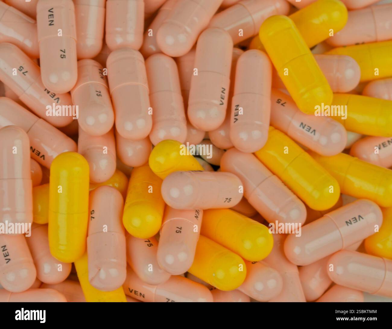 A stack of medicines in capsules. Capsule medication as background. The ...