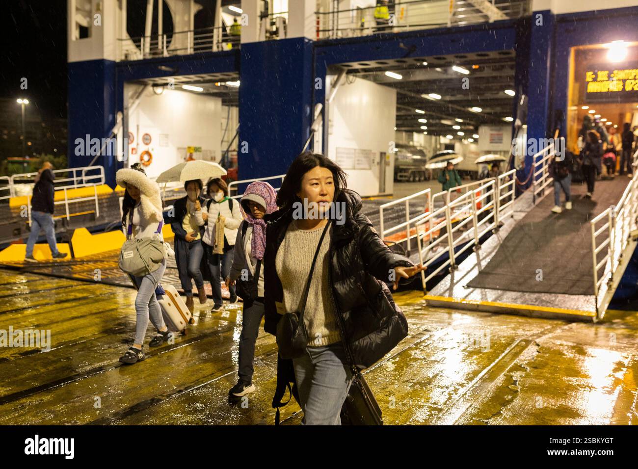 Pireaus, Greece. 04th Feb, 2025. People disembark from a ferry in the ...