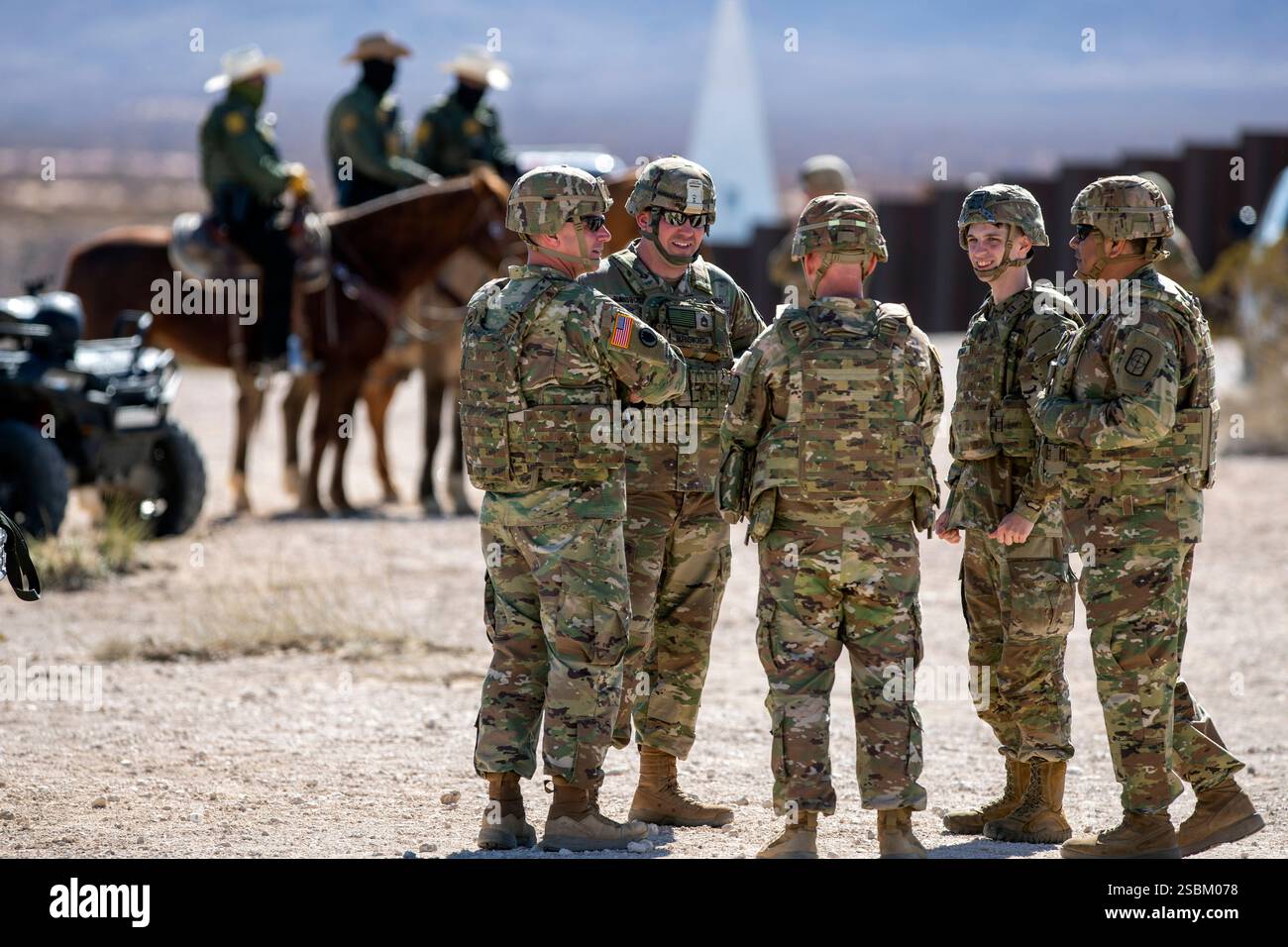 Army soldiers chat while waiting the arrival of Defense Secretary Pete ...