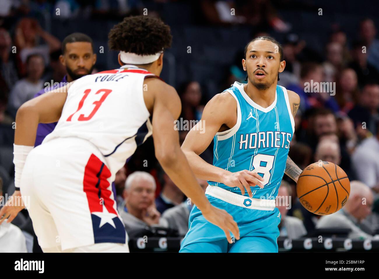 Charlotte Hornets guard Nick Smith Jr. (8) looks to pass the ball ...