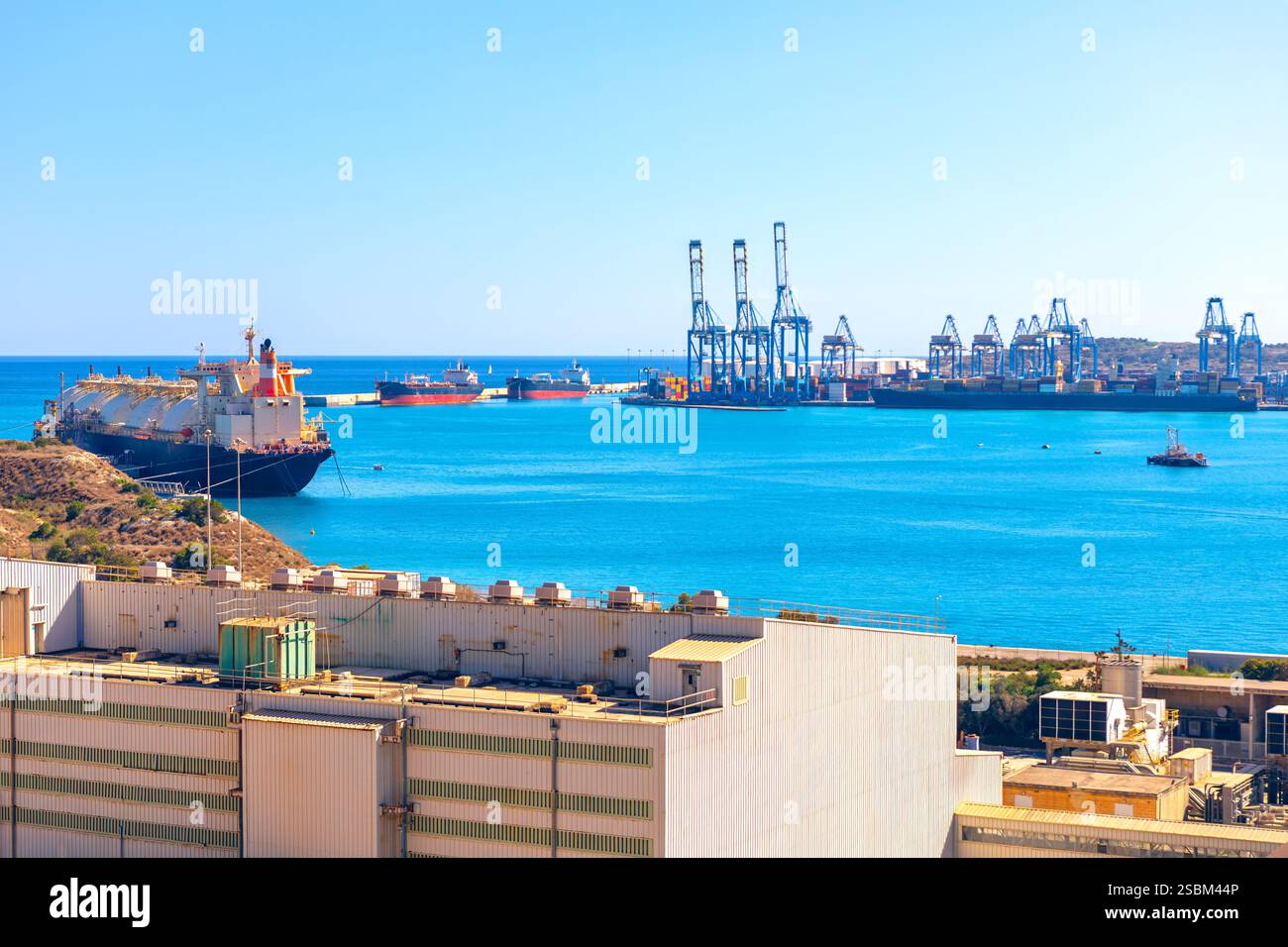 View of the Port in Malta showcasing cargo ships and cranes Stock Photo ...
