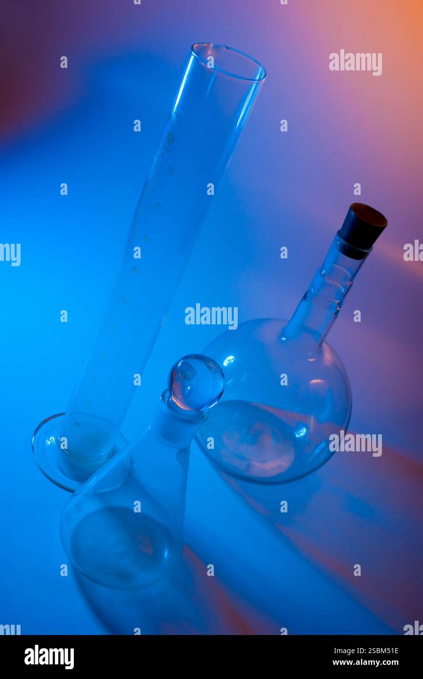 chemical glassware in multicolored lights Stock Photo - Alamy