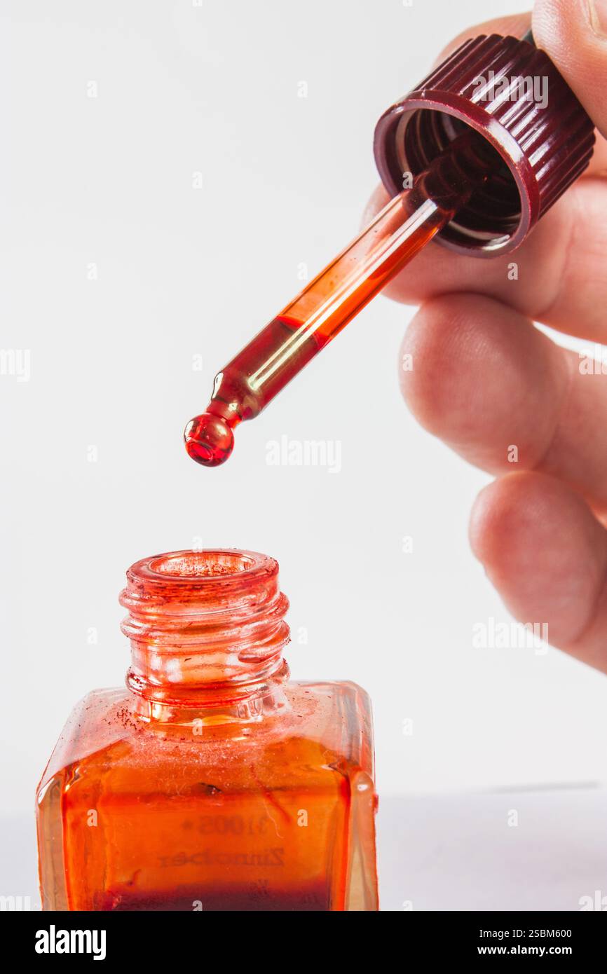 pipette with ink isolated on white background Stock Photo - Alamy