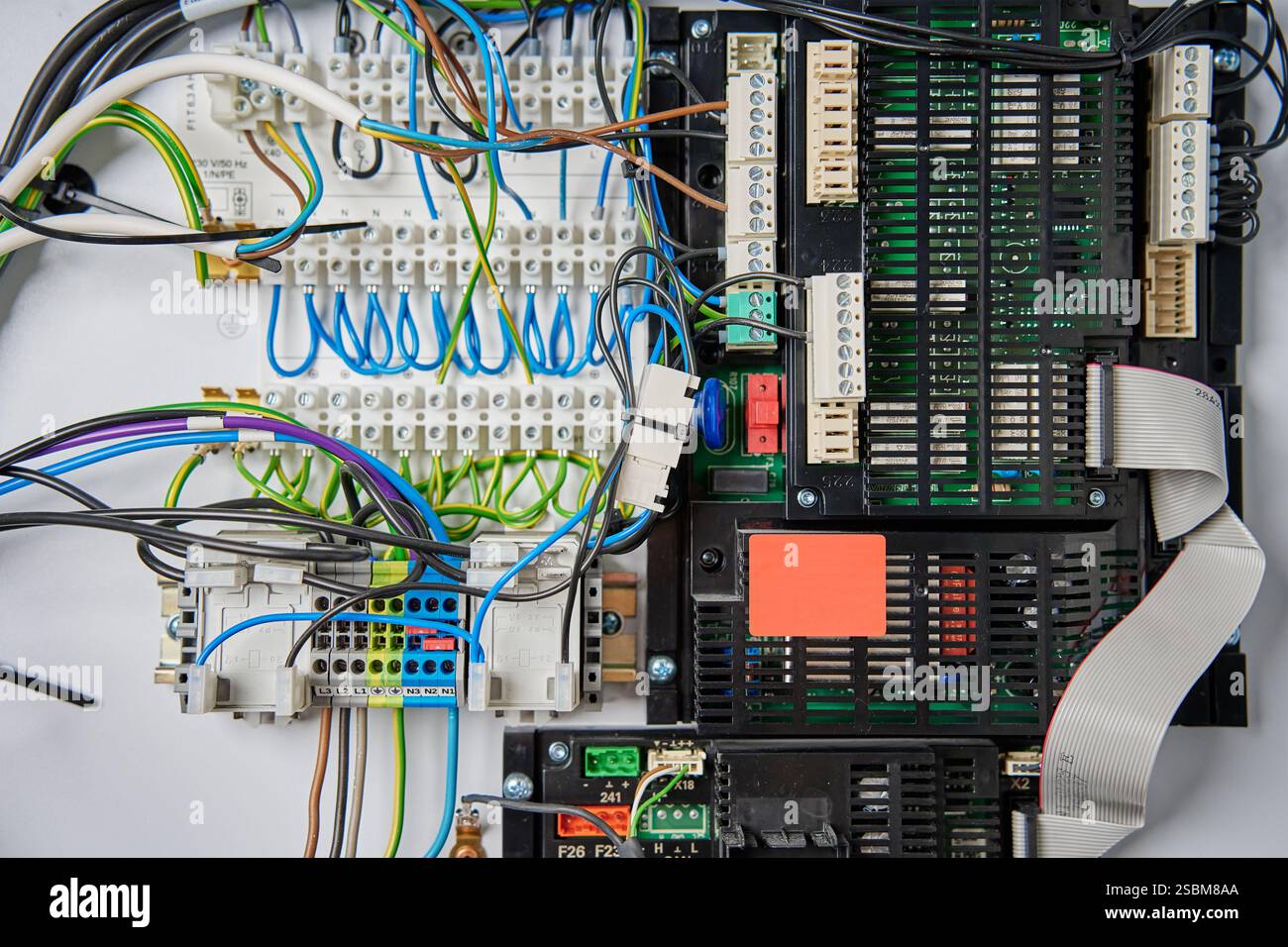Close-up view of wiring system and circuit board inside electrical ...