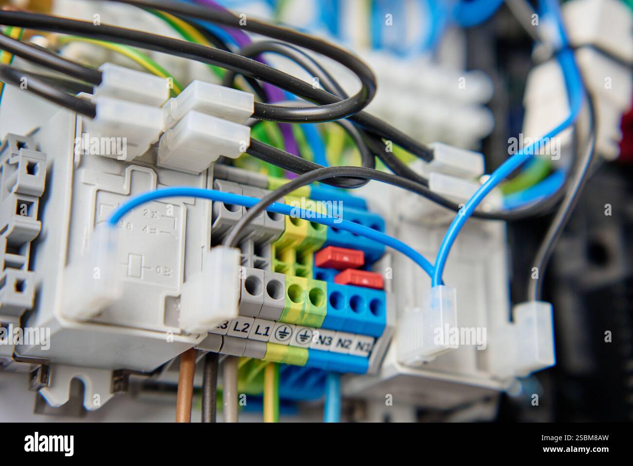 Colorful wires and components connected to terminal block in ...