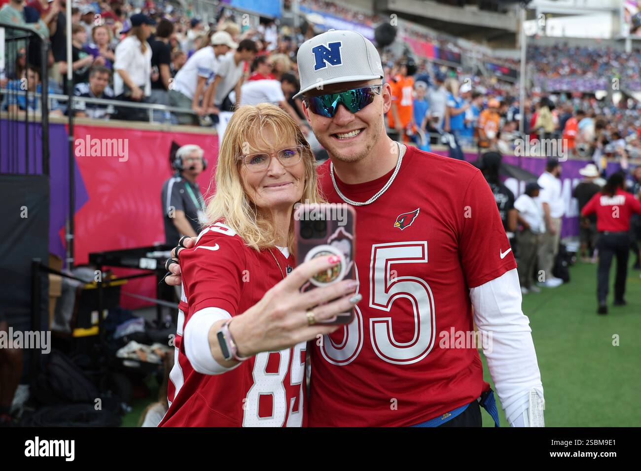 Trey McBride poses with his mom for a selfie during the NFL Pro Bowl ...