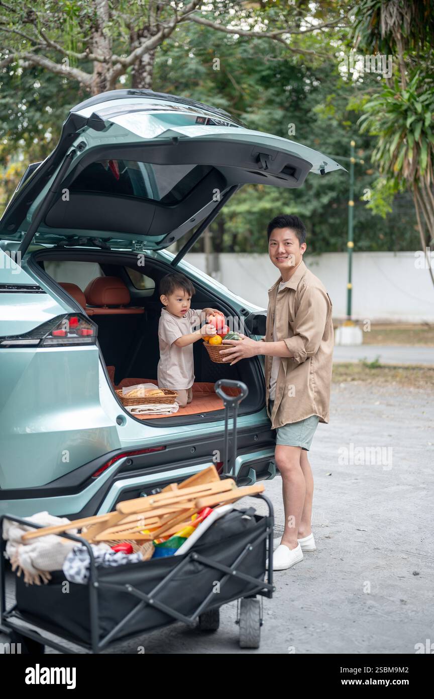 An innocent little Asian boy and his dad are in the trunk of their car ...