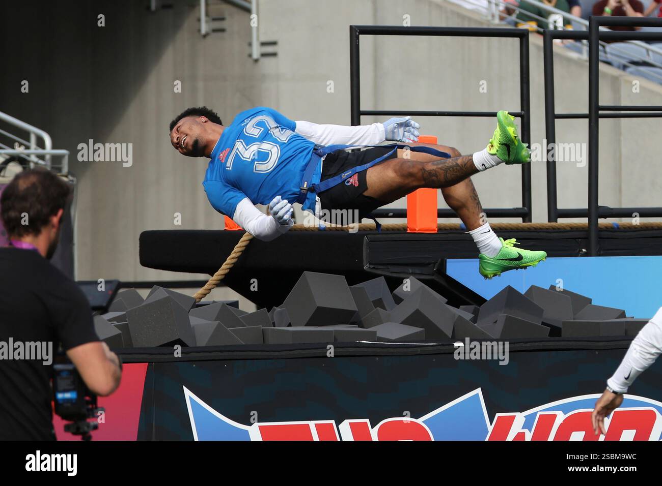 Jahmyr Gibbs dives into the tug of war cushions during the NFL Pro Bowl ...