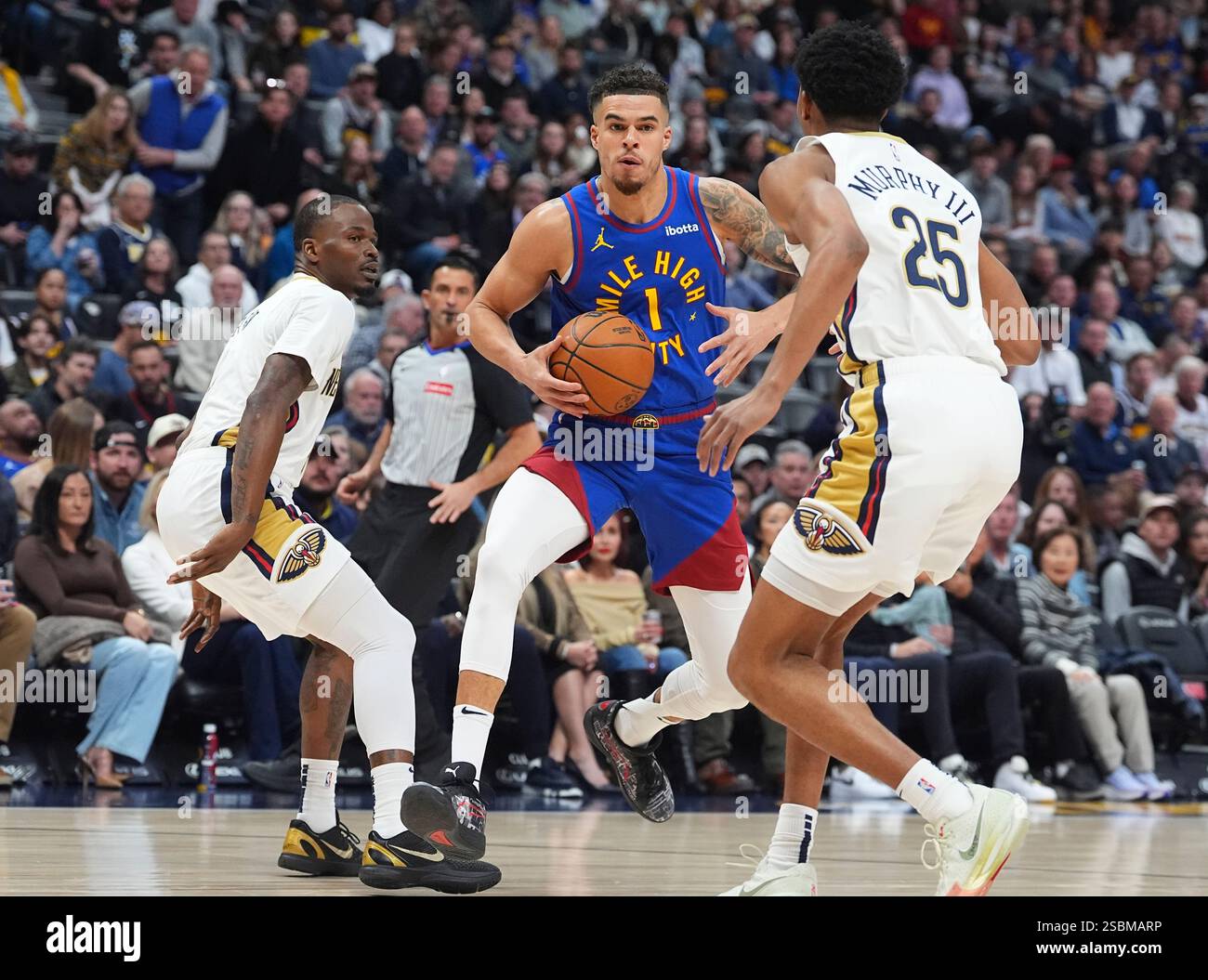 Denver Nuggets forward Michael Porter Jr., center, drives to the basket ...