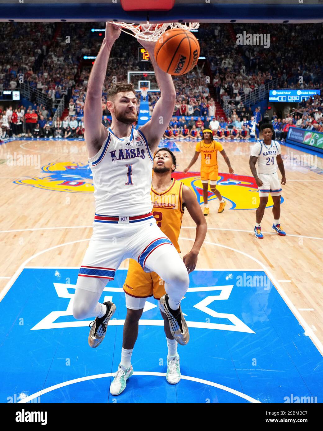 Kansas center Hunter Dickinson (1) dunks the ball during the first half ...