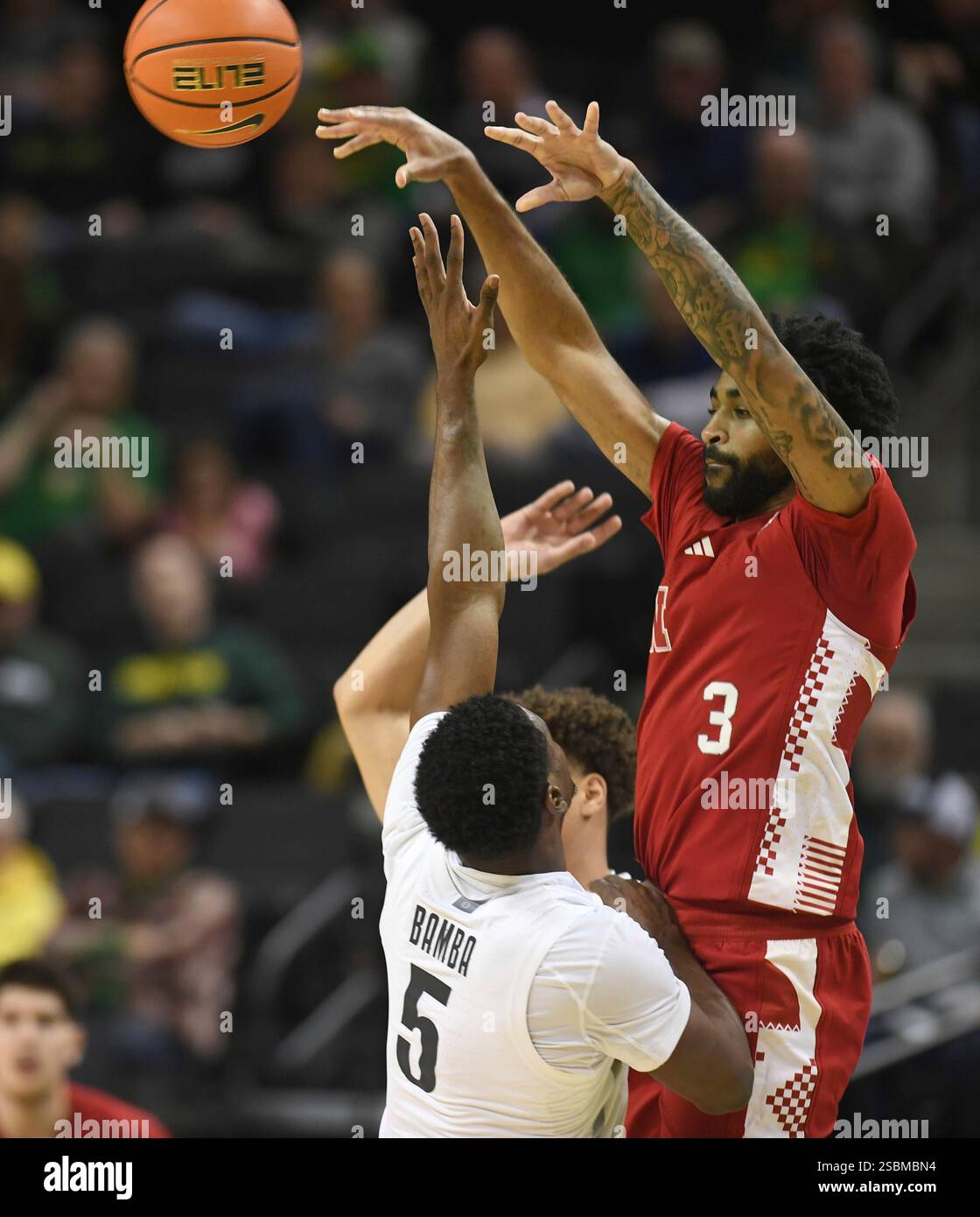 Nebraska guard Brice Williams (3) passes over Oregon guard TJ Bamba (5 ...