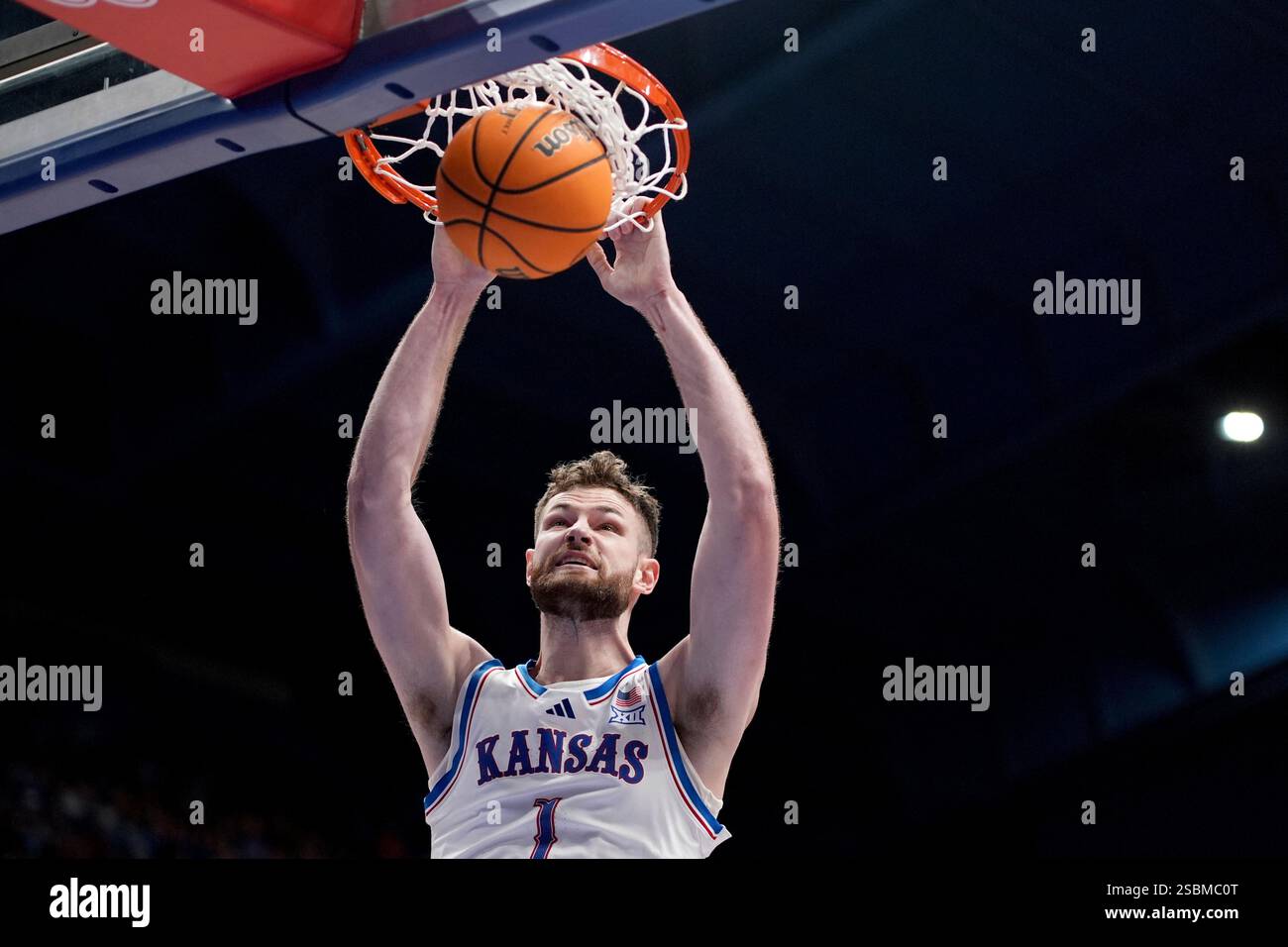 Kansas center Hunter Dickinson dunks the ball during the first half of ...