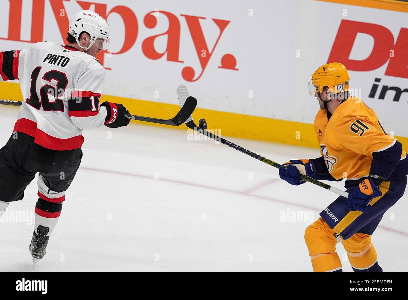 Ottawa Senators center Shane Pinto (12) and Nashville Predators center ...