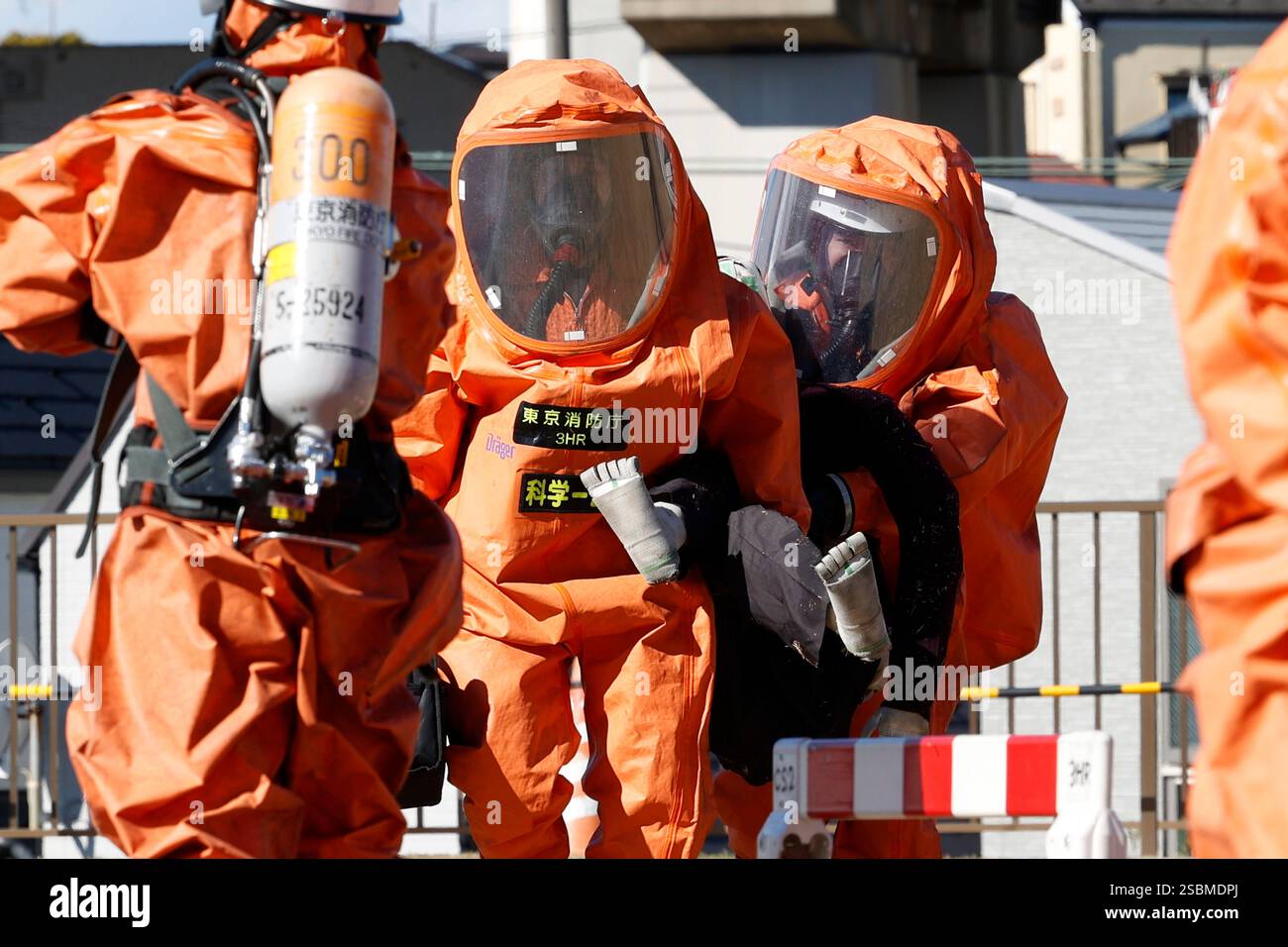 February 4, 2025, Tokyo, Japan: Firefighters wearing protective gears ...