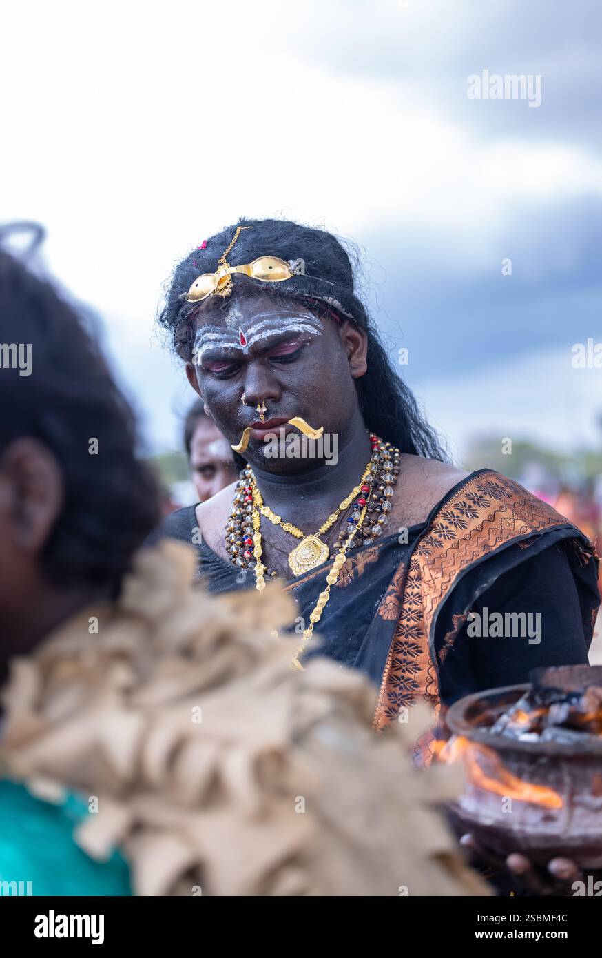 Kulasai, Portrait of indian hindu devotee with painted face and dressed ...
